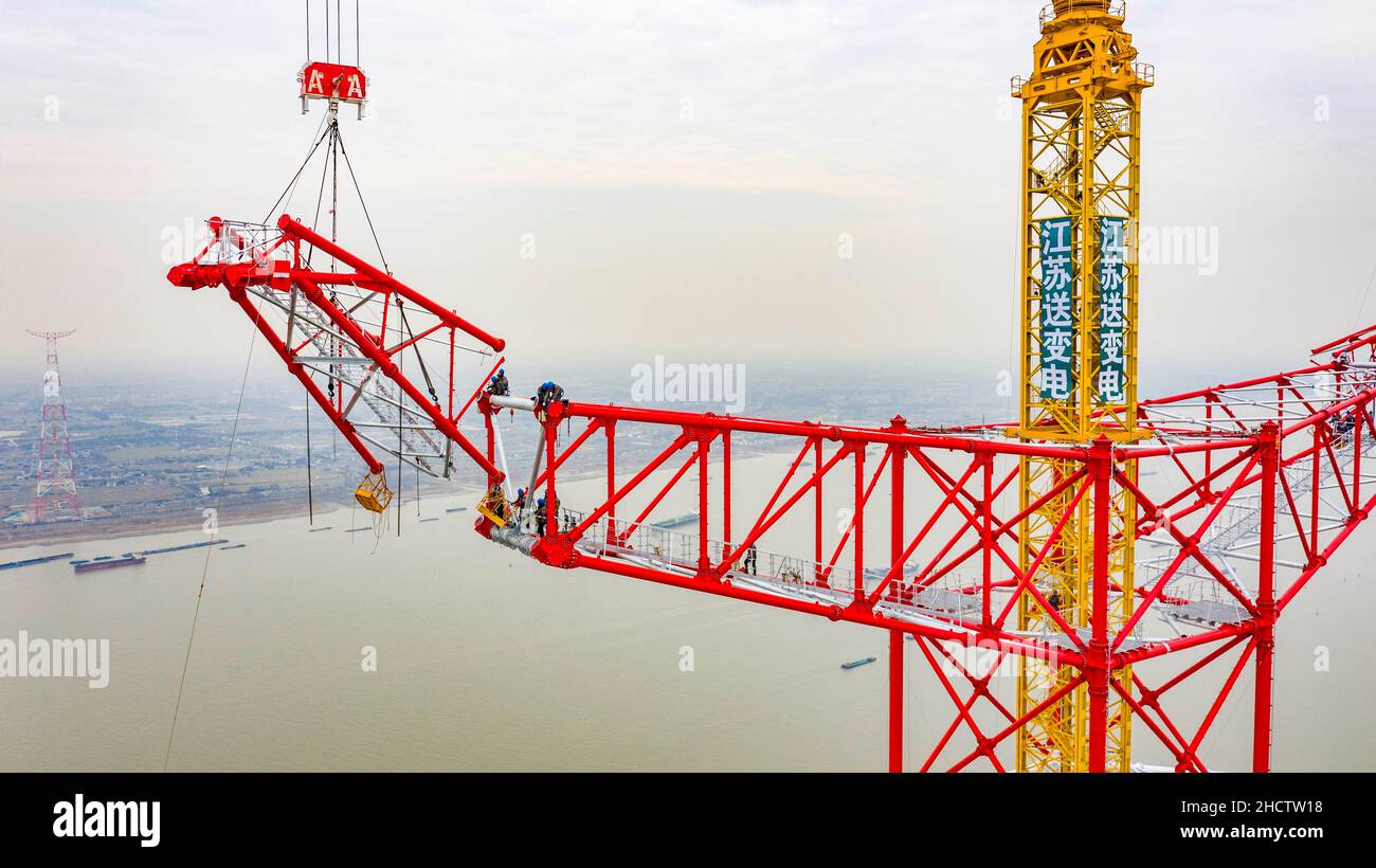 WUXI, CHINA - JANUARY 1, 2022 - Construction workers assemble the world's tallest power ...