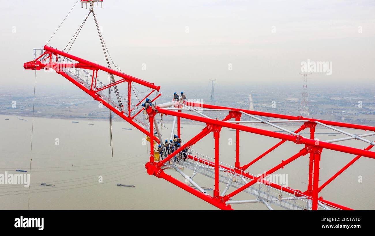 WUXI, CHINA - JANUARY 1, 2022 - Construction workers assemble the world's tallest power ...
