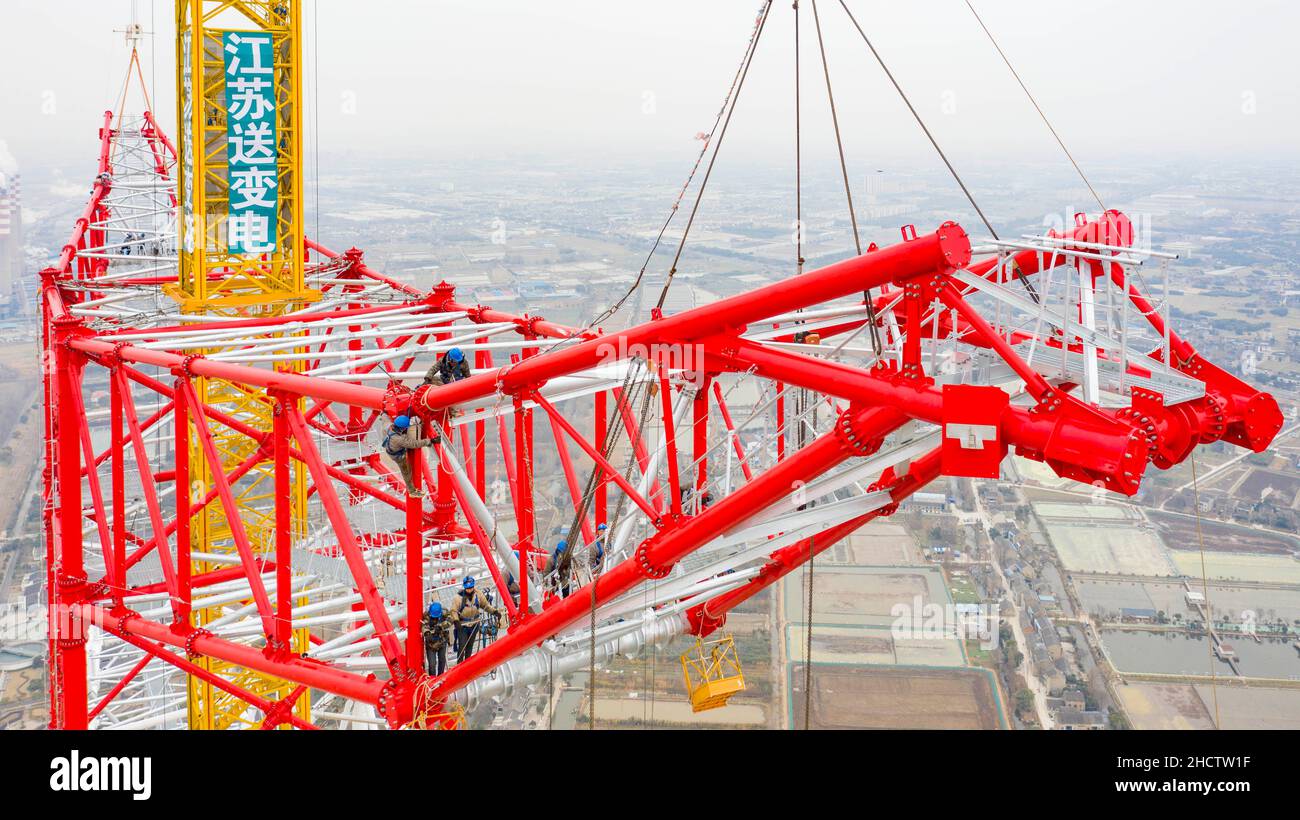 WUXI, CHINA - JANUARY 1, 2022 - Construction workers assemble the world's tallest power ...