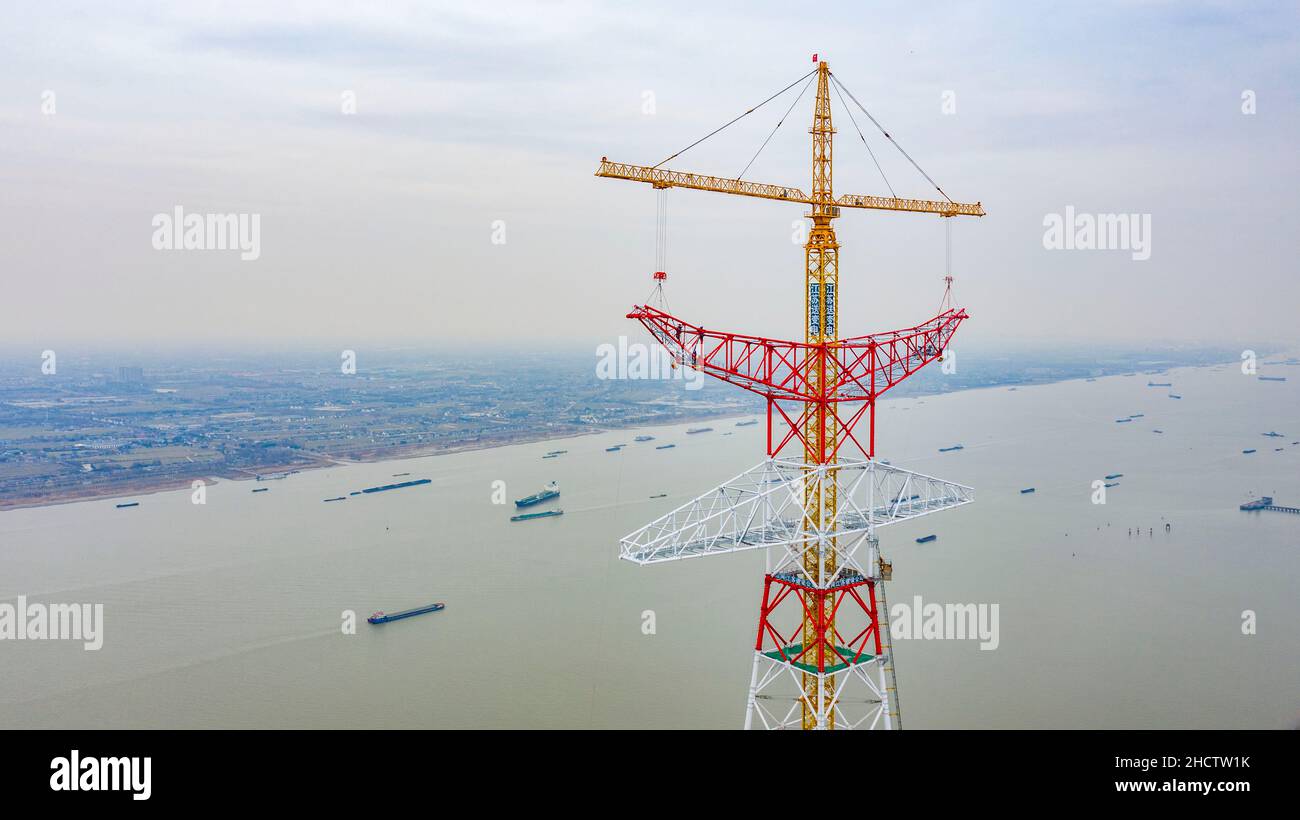WUXI, CHINA - JANUARY 1, 2022 - Construction workers assemble the world's tallest power ...