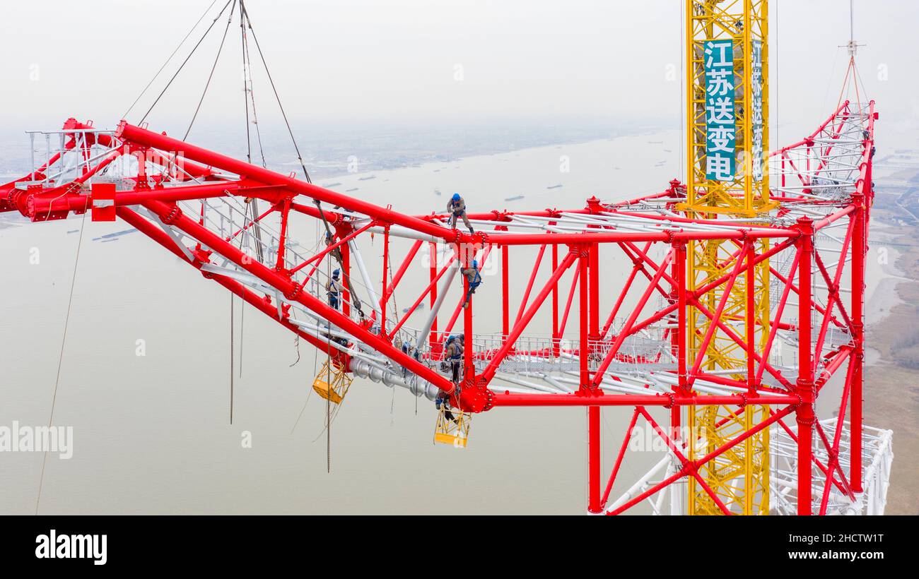 WUXI, CHINA - JANUARY 1, 2022 - Construction workers assemble the world's tallest power ...