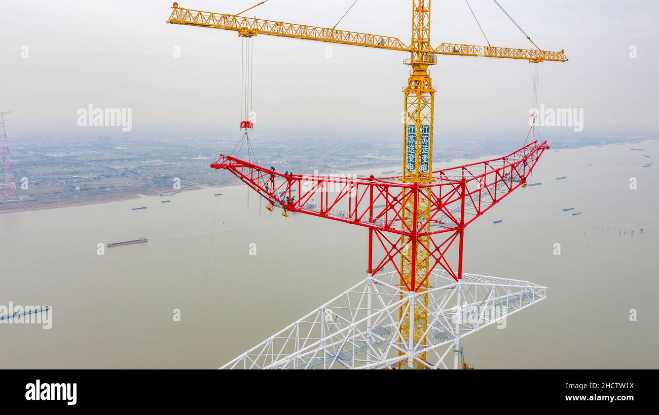 WUXI, CHINA - JANUARY 1, 2022 - Construction workers assemble the world's tallest power ...