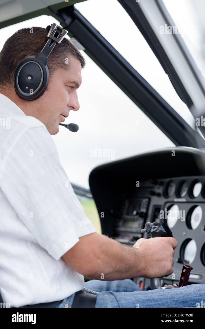 portrait of pilot in helicopter Stock Photo - Alamy