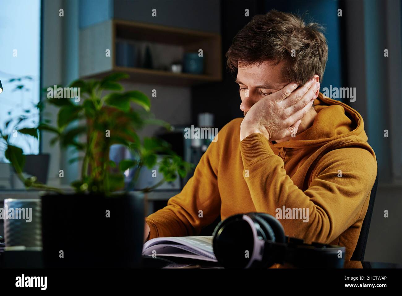 Man works late at home workplace, remote work concept. Burnout and ...