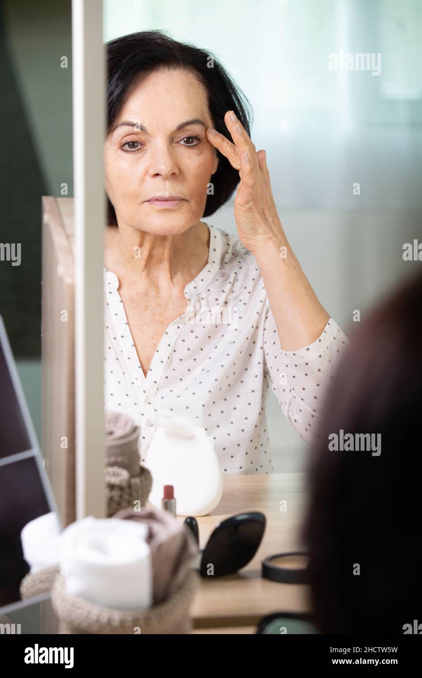 charming woman touching her perfect soft face skin with fingers Stock ...