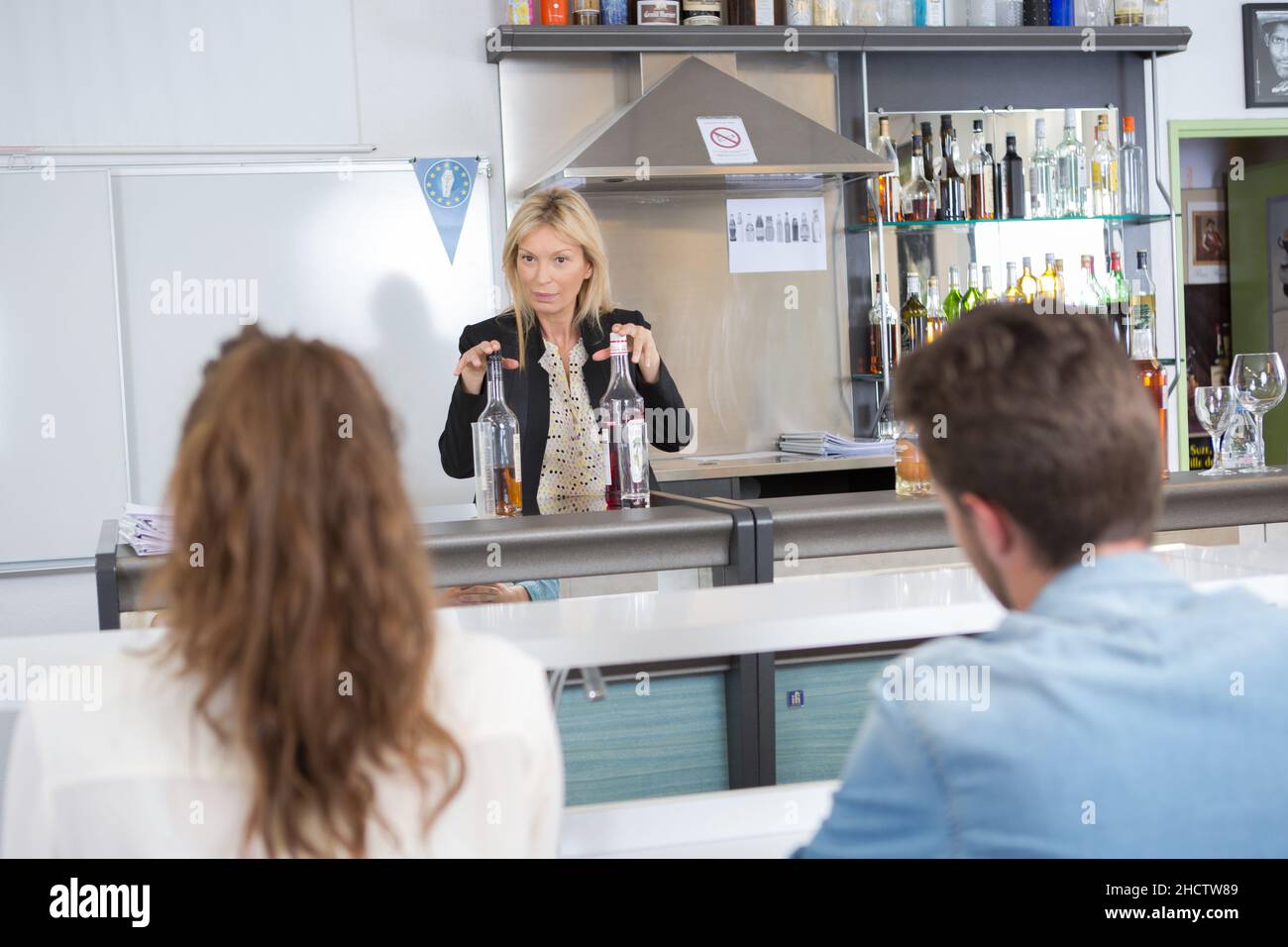 two young adult students studying at wine class Stock Photo - Alamy