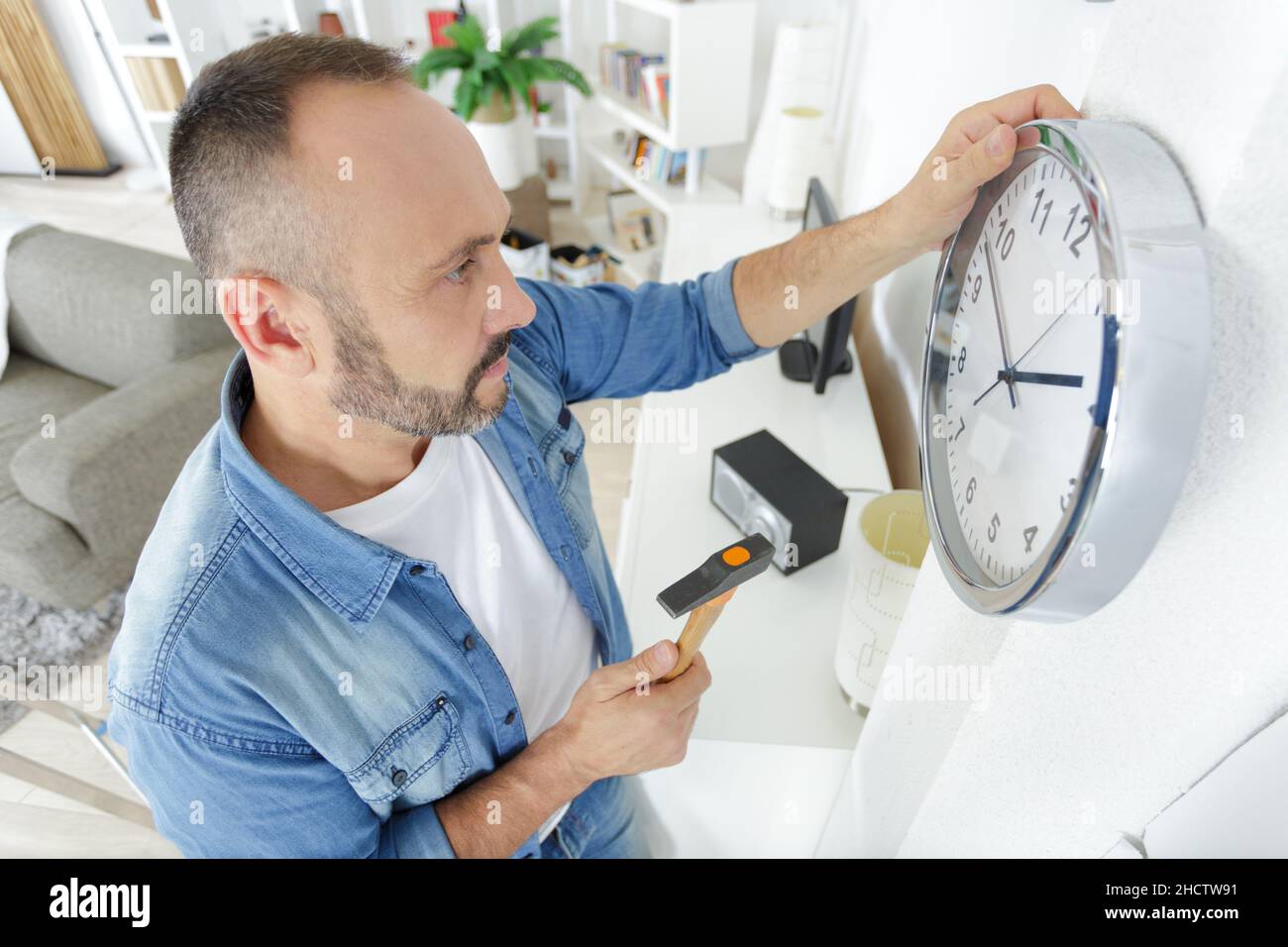 Man clock hammer hi-res stock photography and images - Alamy