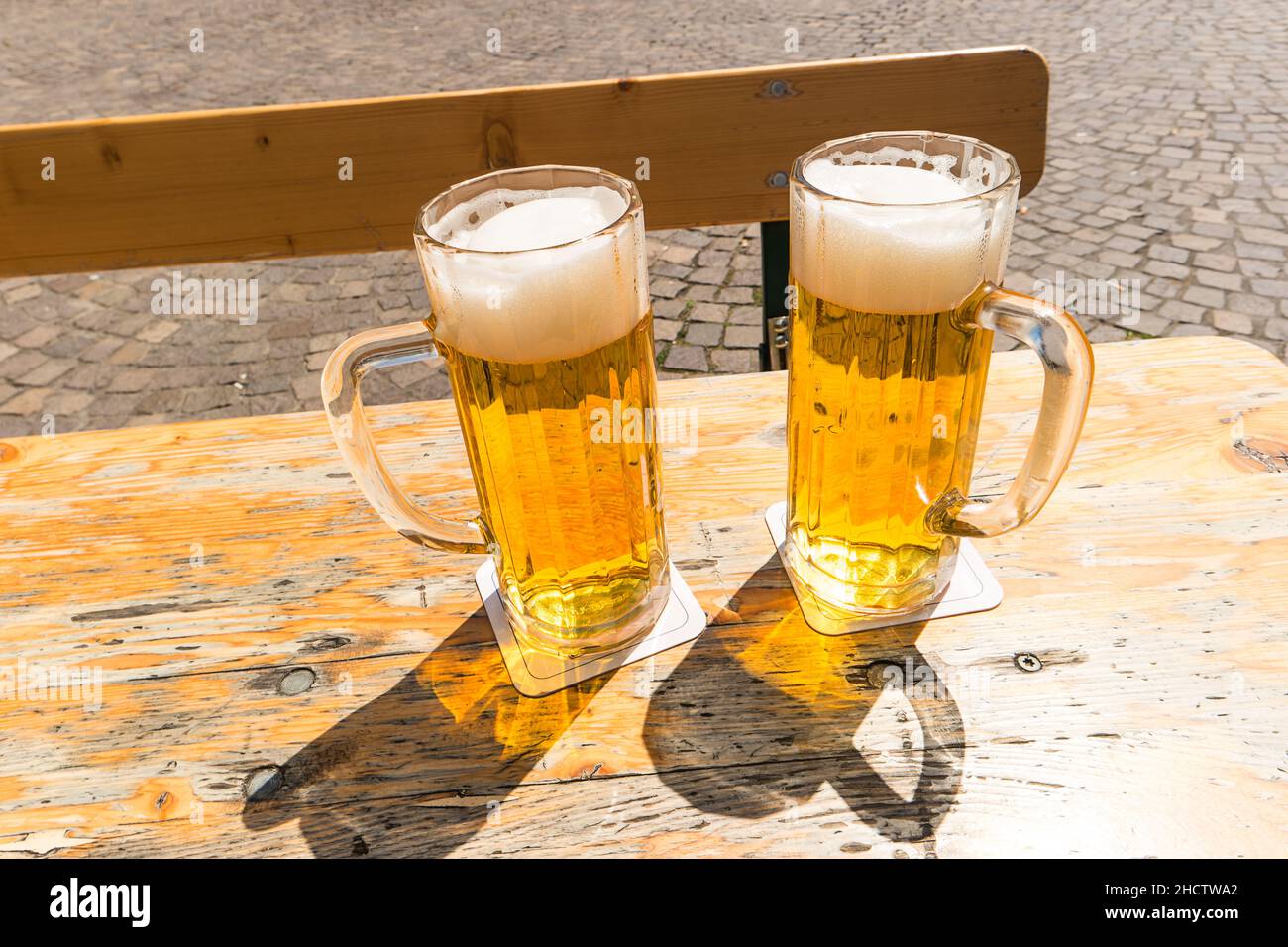 Two beers on table in the garden pub Stock Photo - Alamy