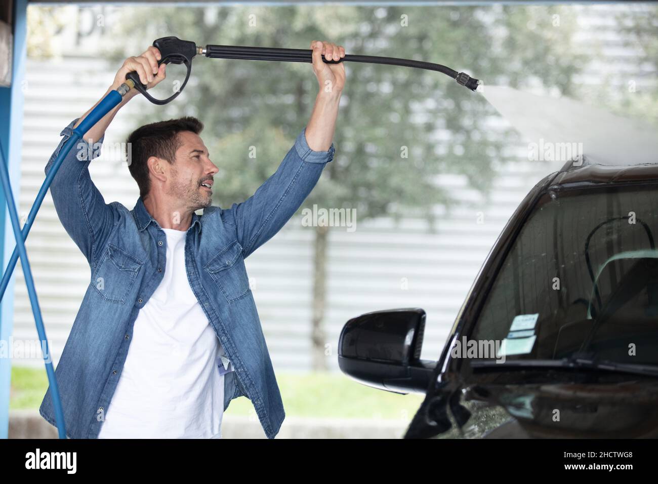 Man uses pressure washer hi-res stock photography and images - Alamy