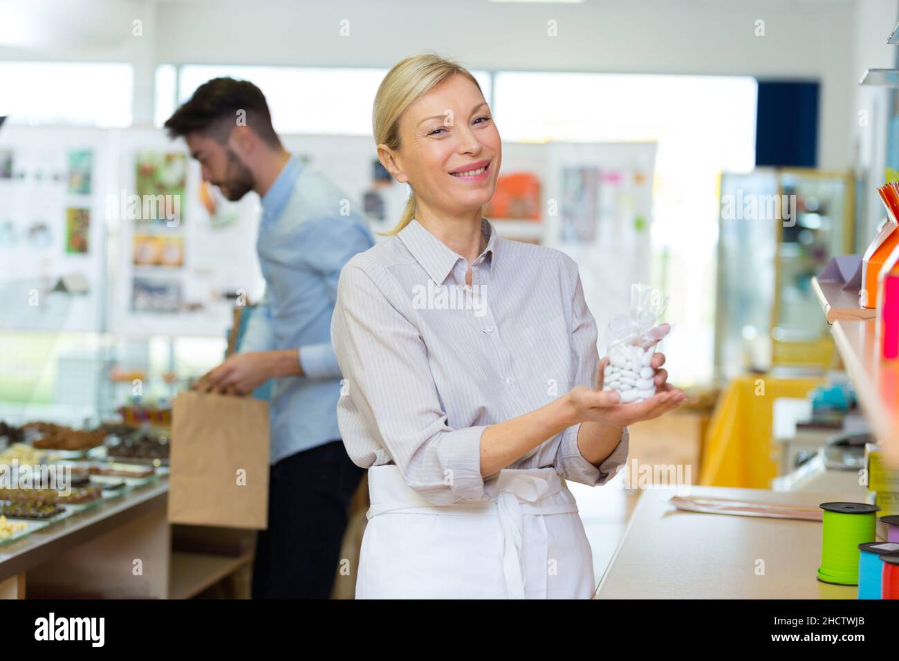 Woman selling sweets hi-res stock photography and images - Alamy
