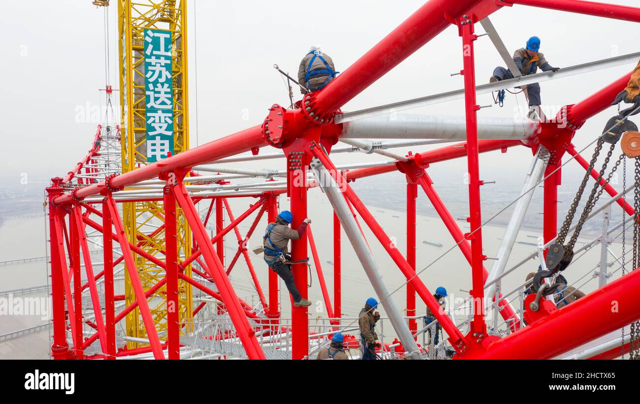 WUXI, CHINA - JANUARY 1, 2022 - Construction workers assemble the world's tallest power ...