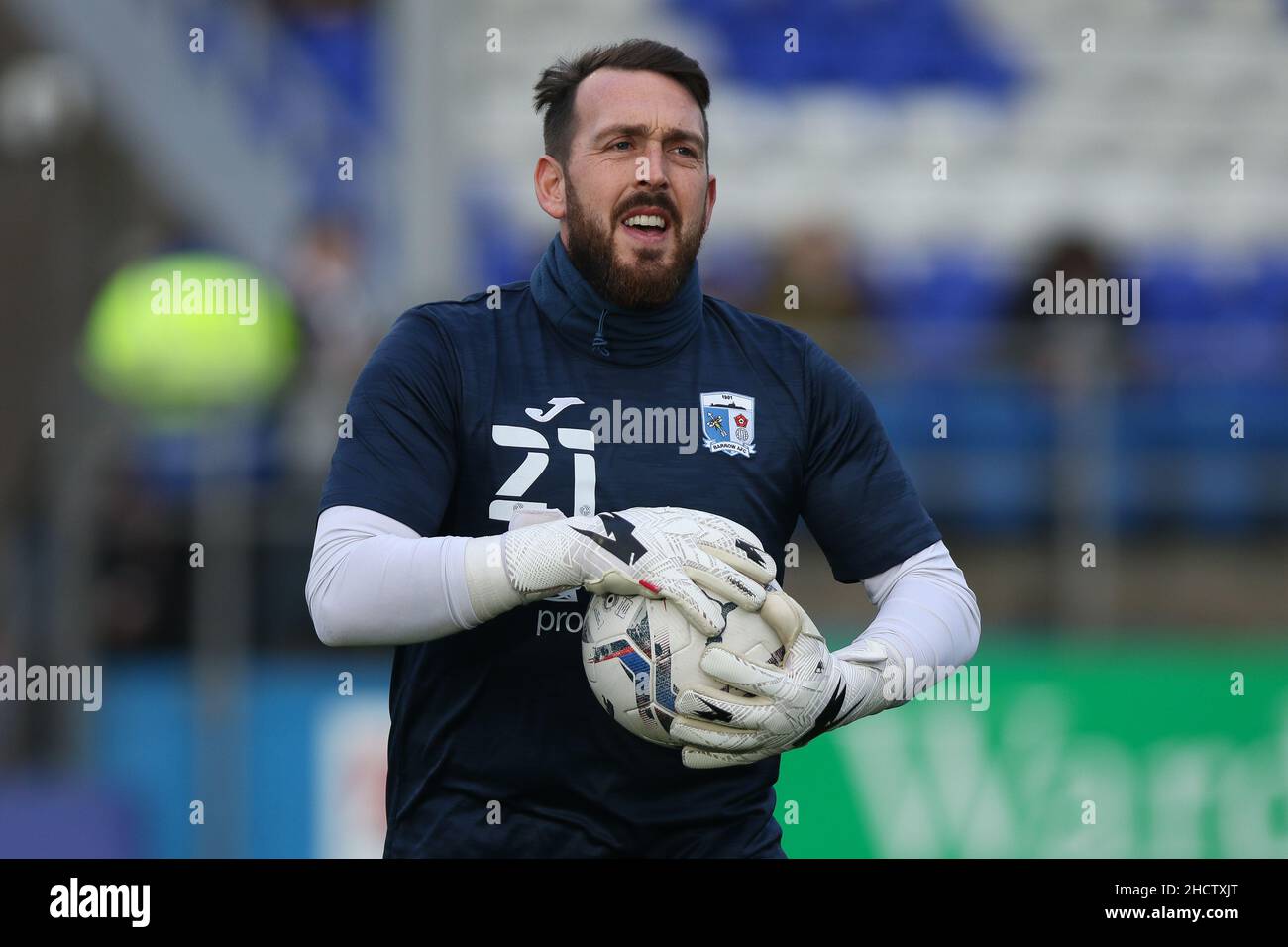 Barrow in Furness, UK. JAN 1ST Scott Moloney of Barrow warms up during ...