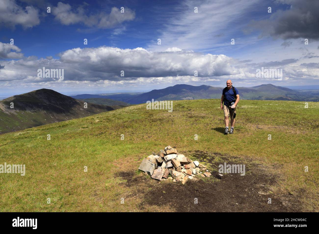 The summit cairn on Sail fell above the Coledale Hause valley, Lake ...