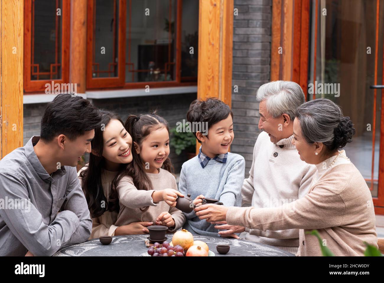 Two children talking to adult hi-res stock photography and images - Alamy