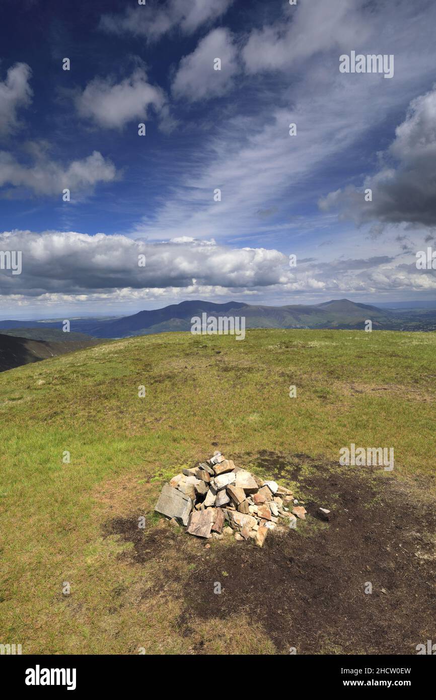 The summit cairn on Sail fell above the Coledale Hause valley, Lake ...