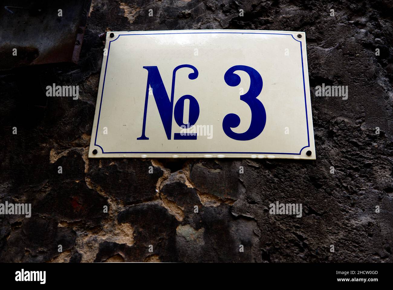 Vintage number 3 street sign written in blue letters Stock Photo - Alamy