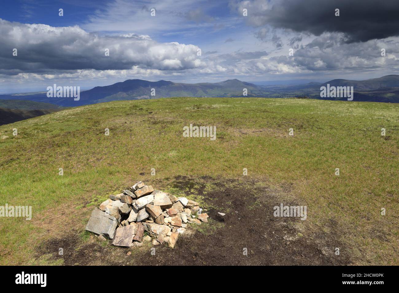 The summit cairn on Sail fell above the Coledale Hause valley, Lake ...