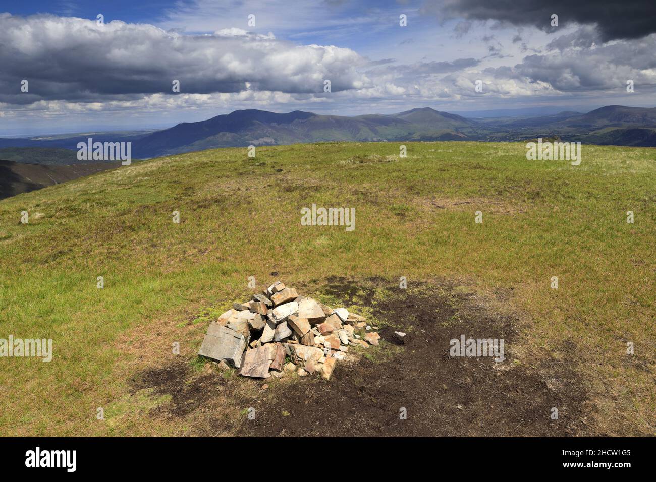 The summit cairn on Sail fell above the Coledale Hause valley, Lake ...