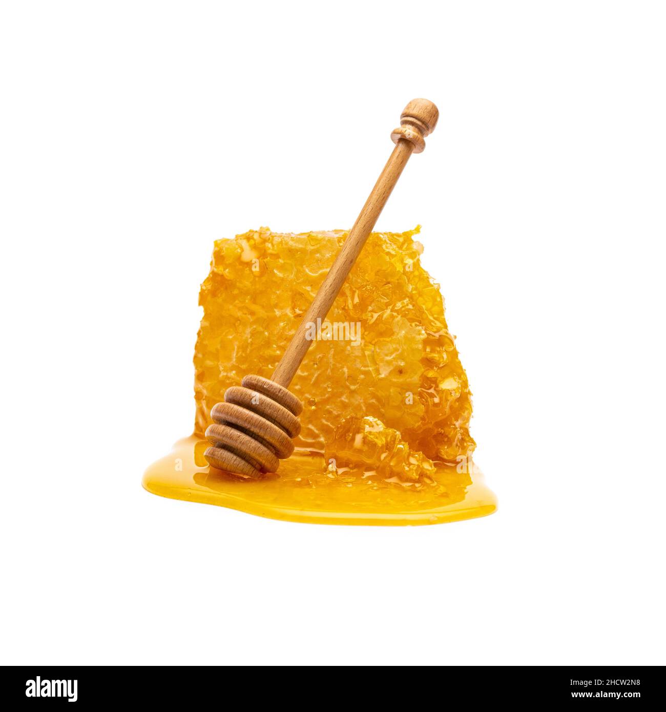 Honeycomb with honey spoon isolated on white background Stock Photo - Alamy