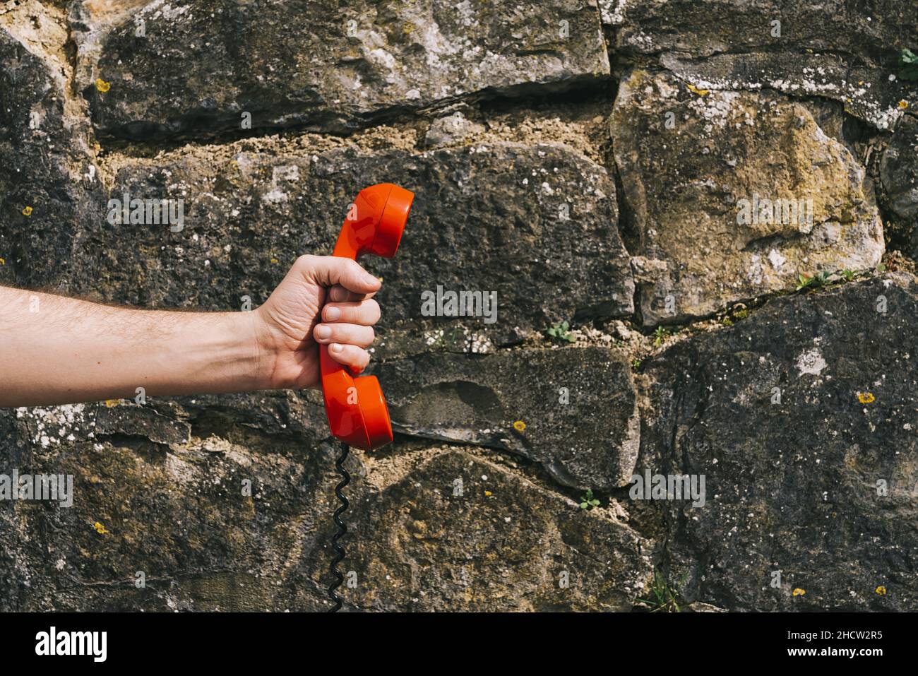 Hand red telephone receiver hi-res stock photography and images - Alamy