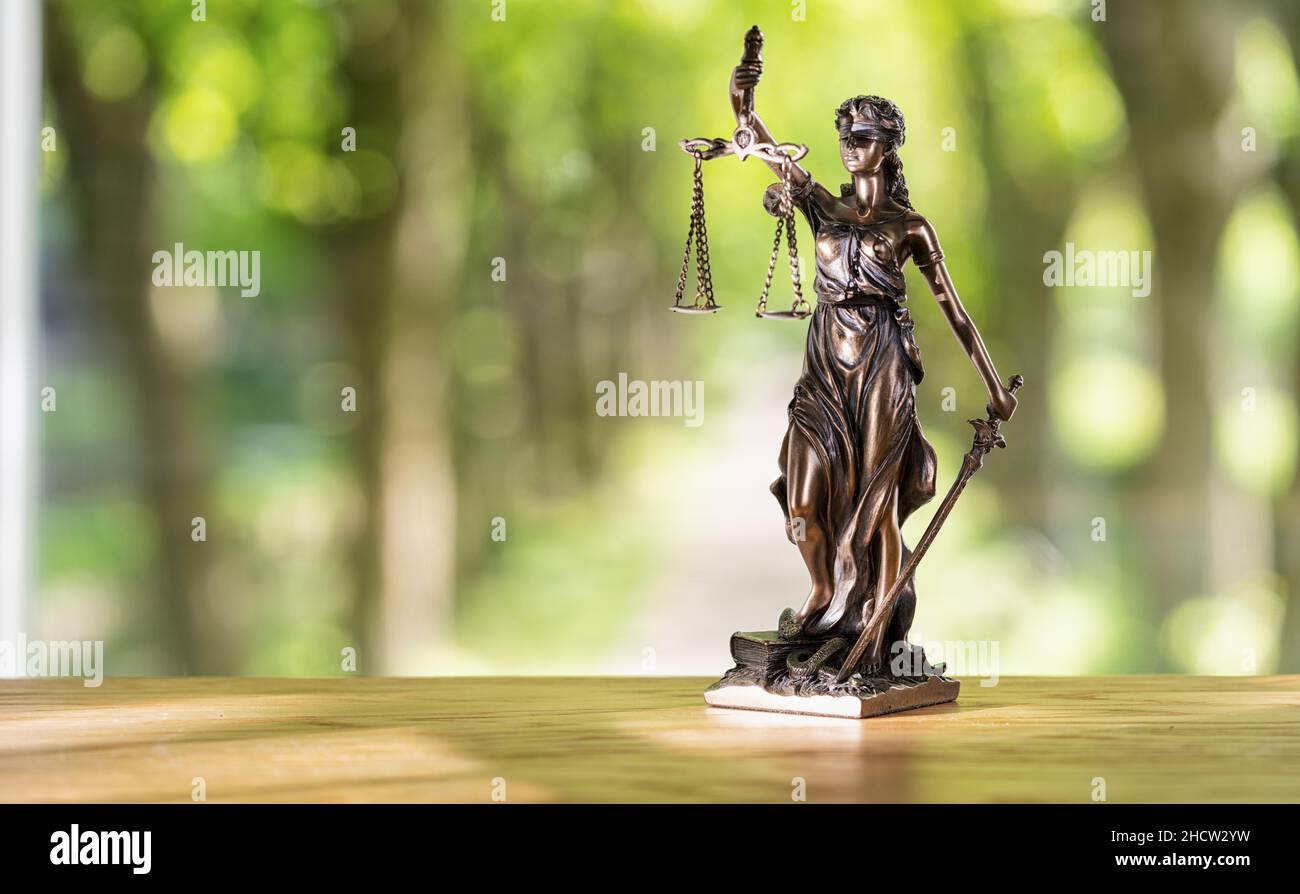 The Statue of Justice symbol in a lawyer offfice, including copy space ...