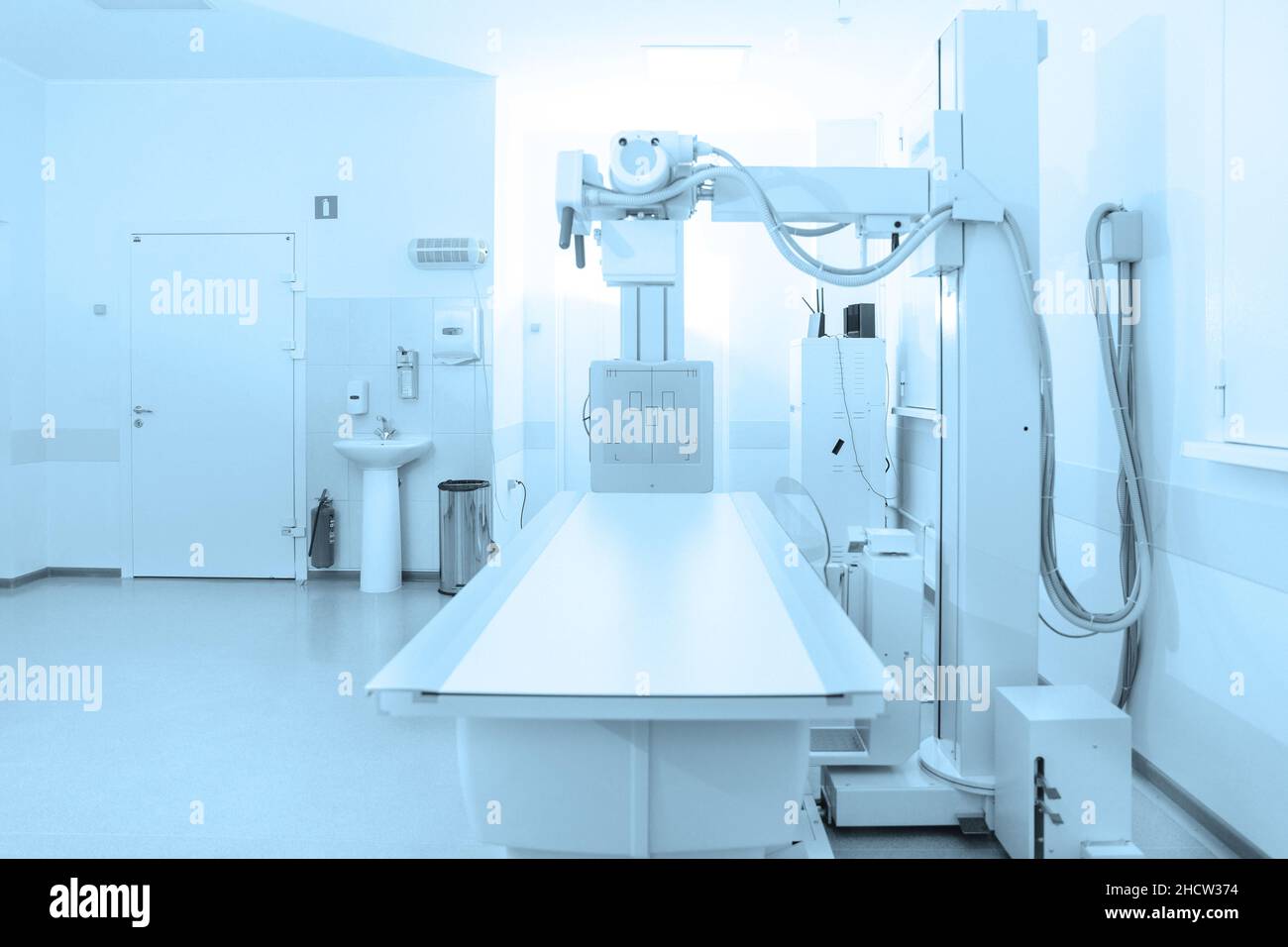 X-ray department in modern hospital. Radiology room with scan machine ...