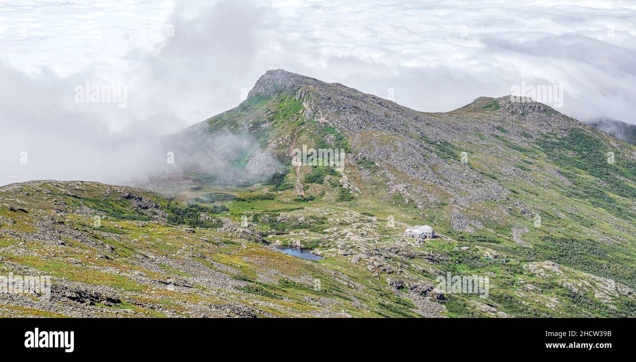 Clouds rolling in on Mount Monroe with Lake in The Clouds Hut in the ...