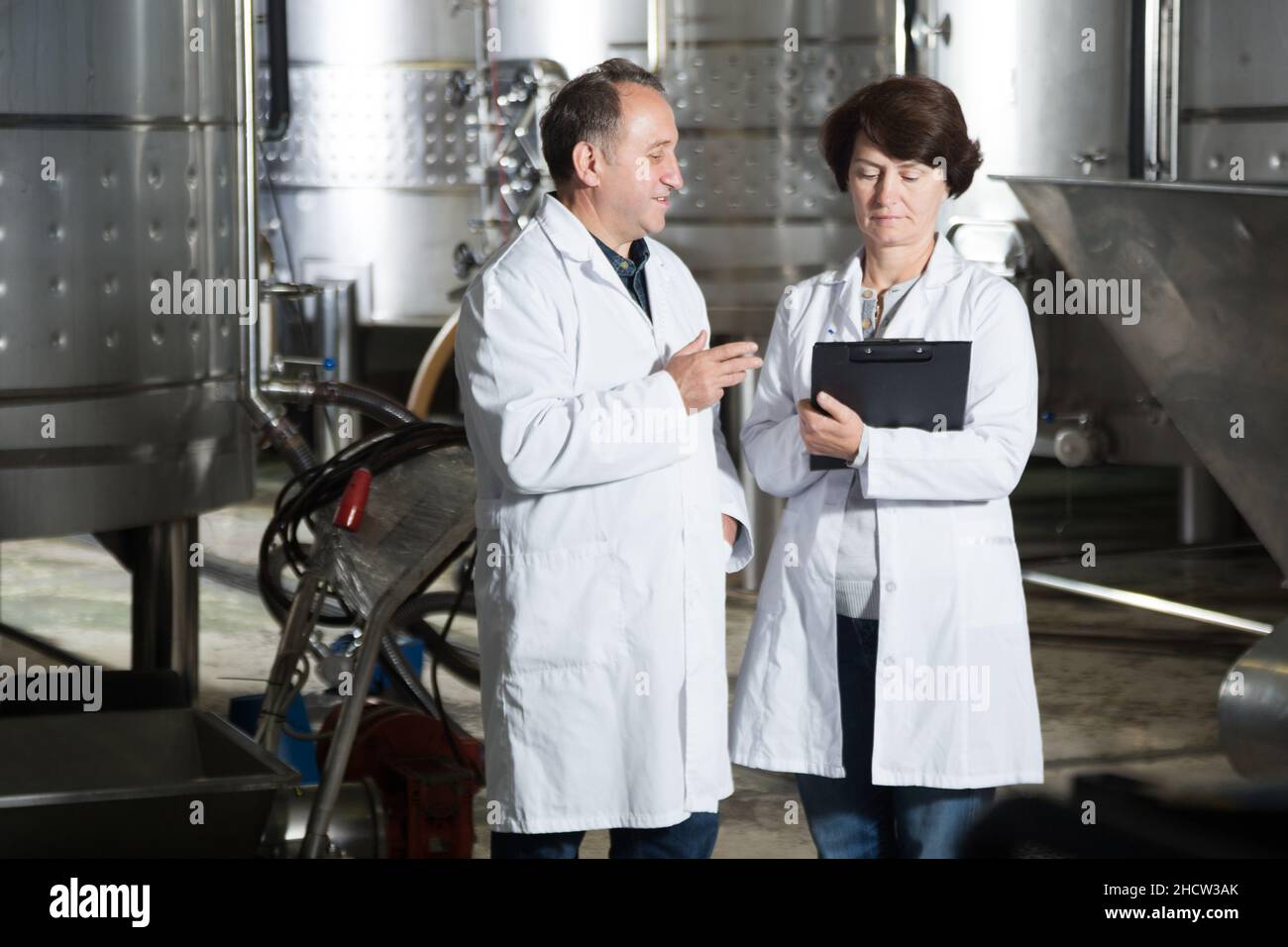 Man and woman check of equipment Stock Photo - Alamy