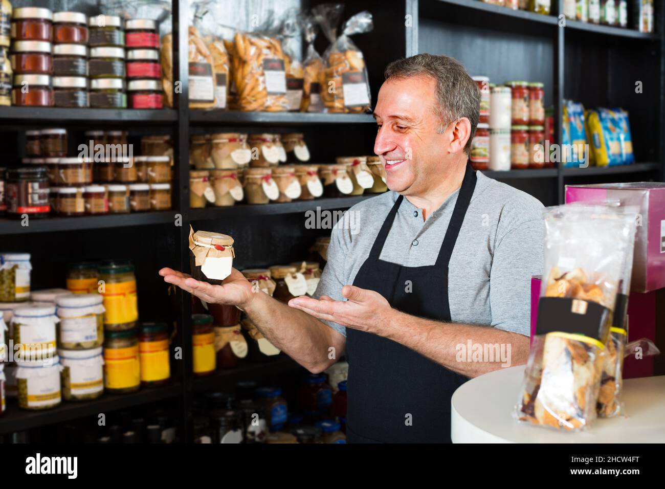 man standing near counter Stock Photo - Alamy