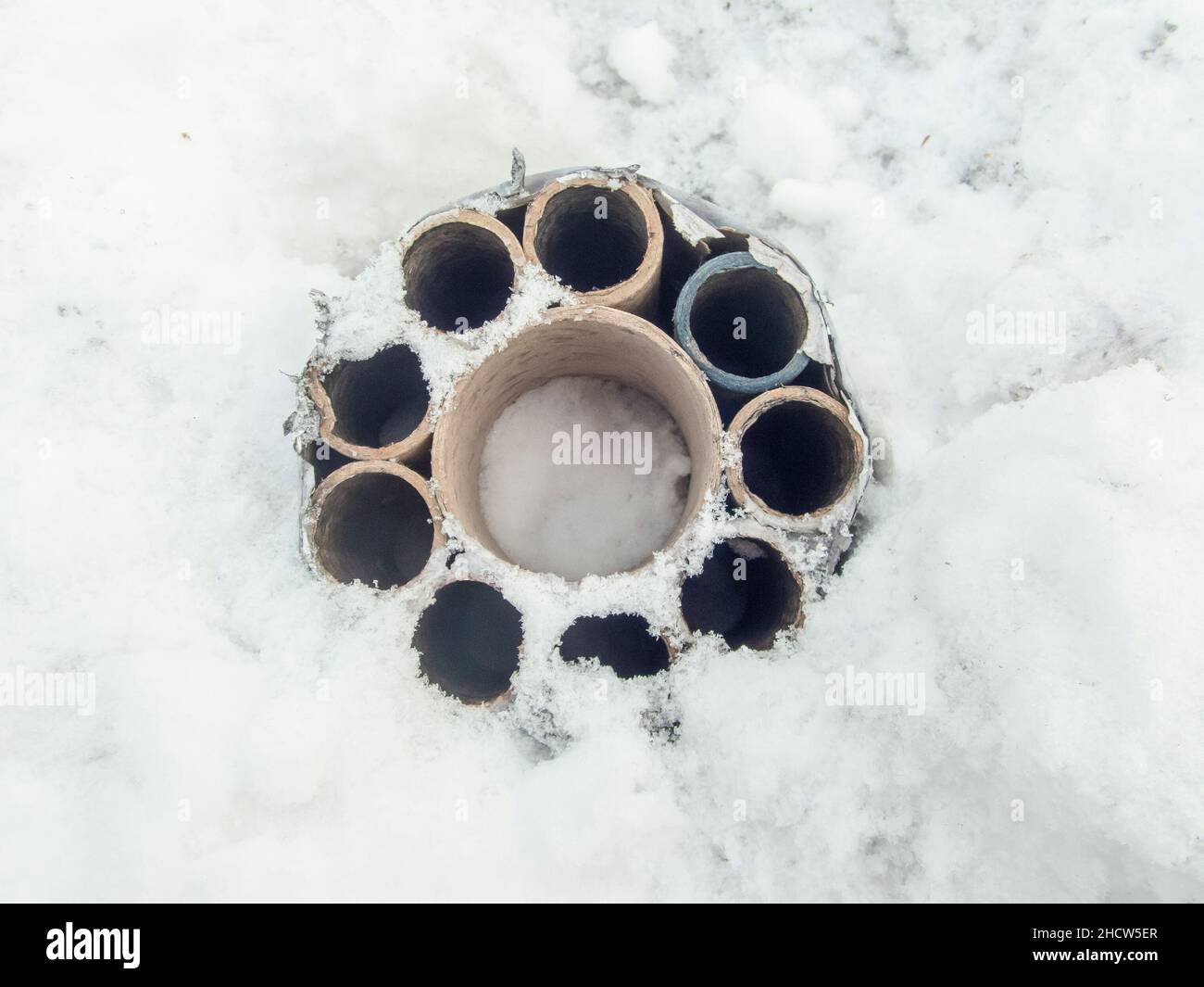Burnt fireworks in the snow. Garbage after the holiday. New Year ...
