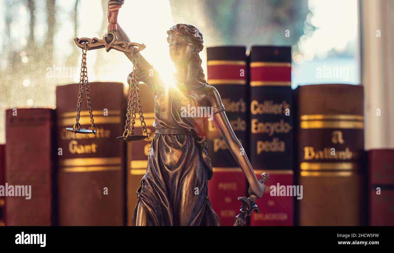Lady Justice (Justitia) with law books in a lawyer office Stock Photo ...