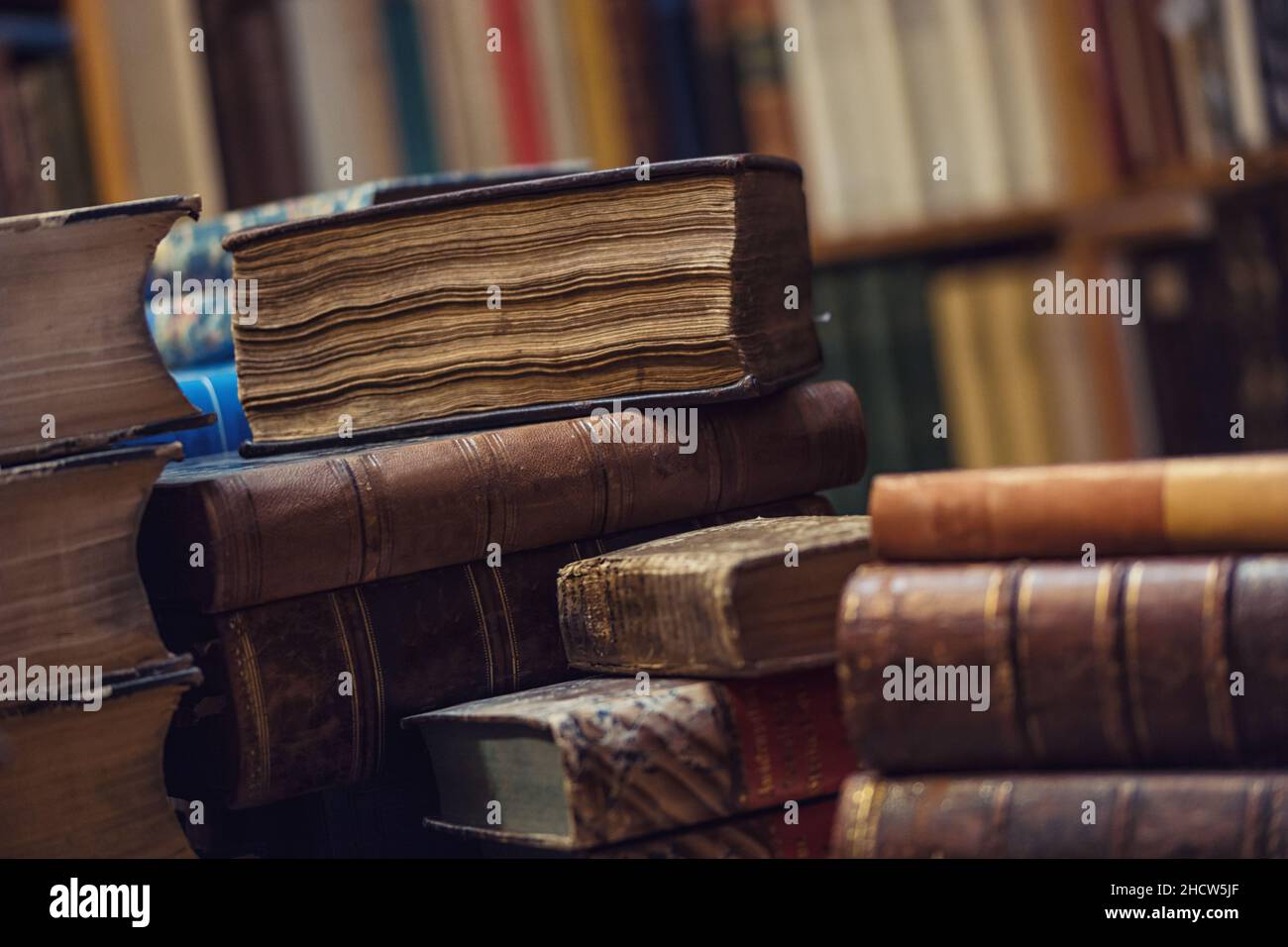 Vintage, antiquarian books pile in the Library Stock Photo - Alamy