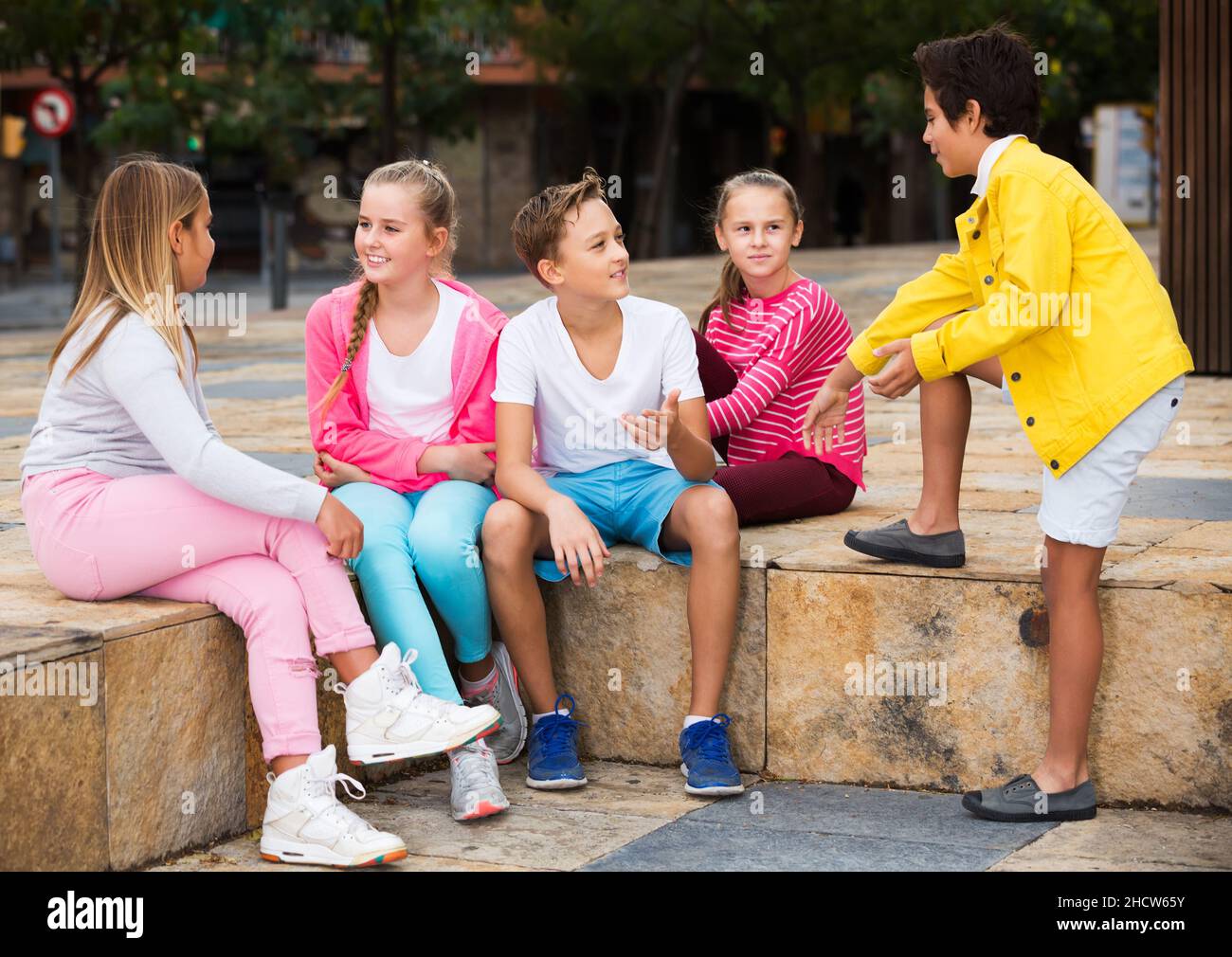 Small children talking on playground hi-res stock photography and ...