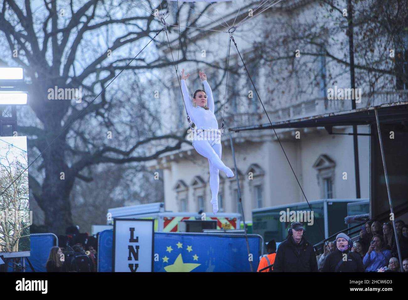 Acrobat hanging from a helium baloon hi-res stock photography and ...