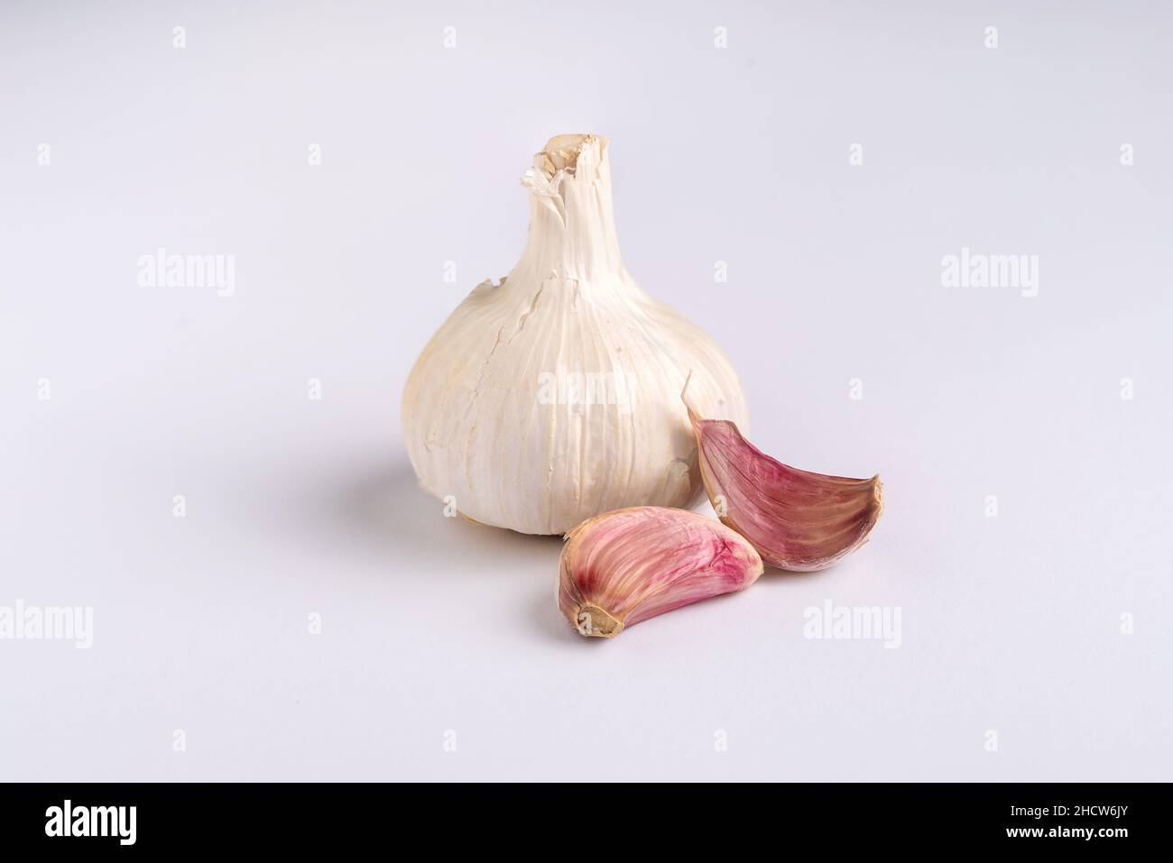 Purple garlic bulb and cloves on white background, horizontal Stock ...