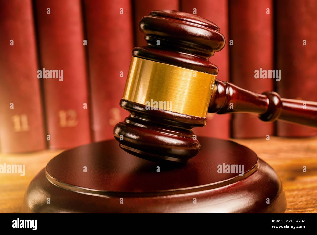 Judges gavel and law books behind Stock Photo - Alamy