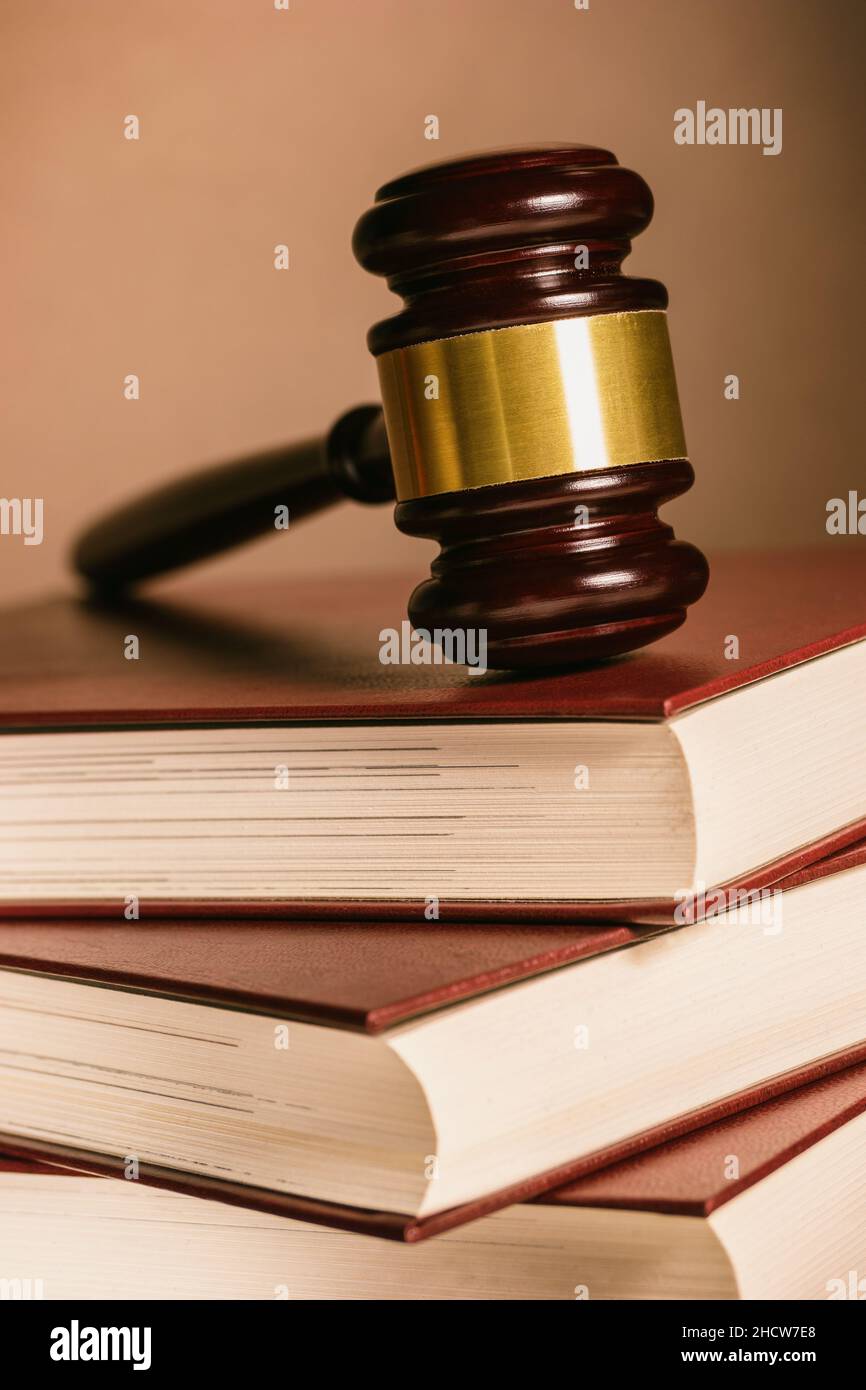 judge gavel lies on stacked Books Stock Photo - Alamy