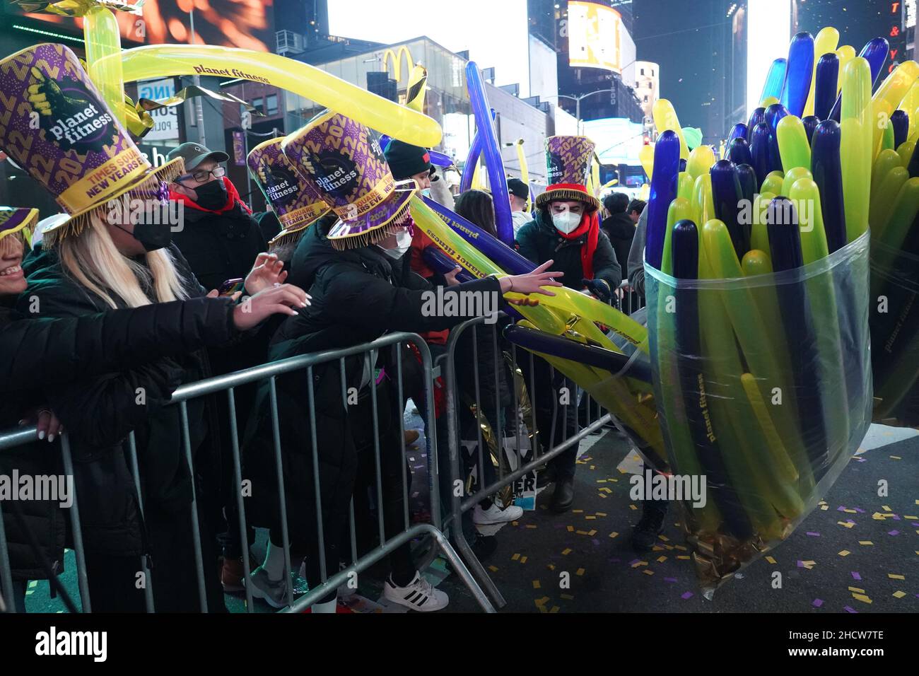 Times Square workers hand out balloons, for the Times Square New Year's ...