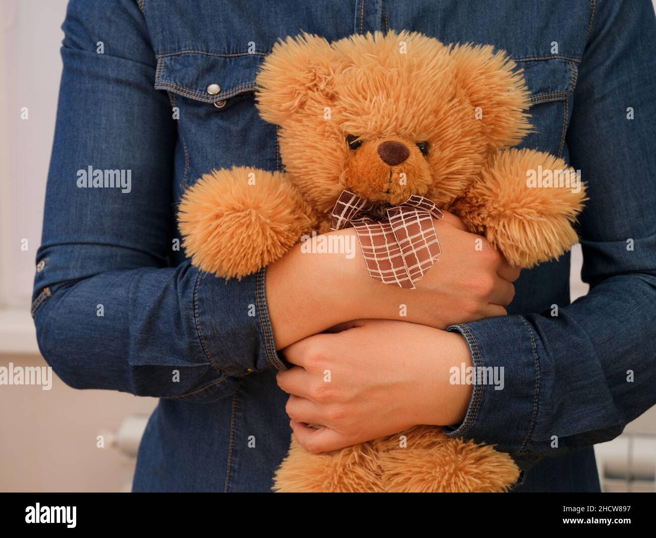 Hugging her teddy hi-res stock photography and images - Alamy