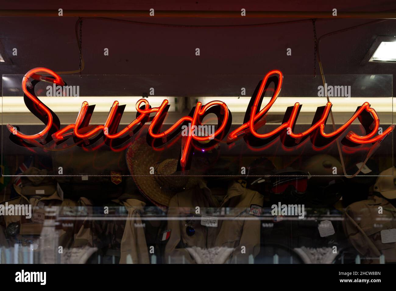 Red neon at the window of a shop selling revoked military uniform ...