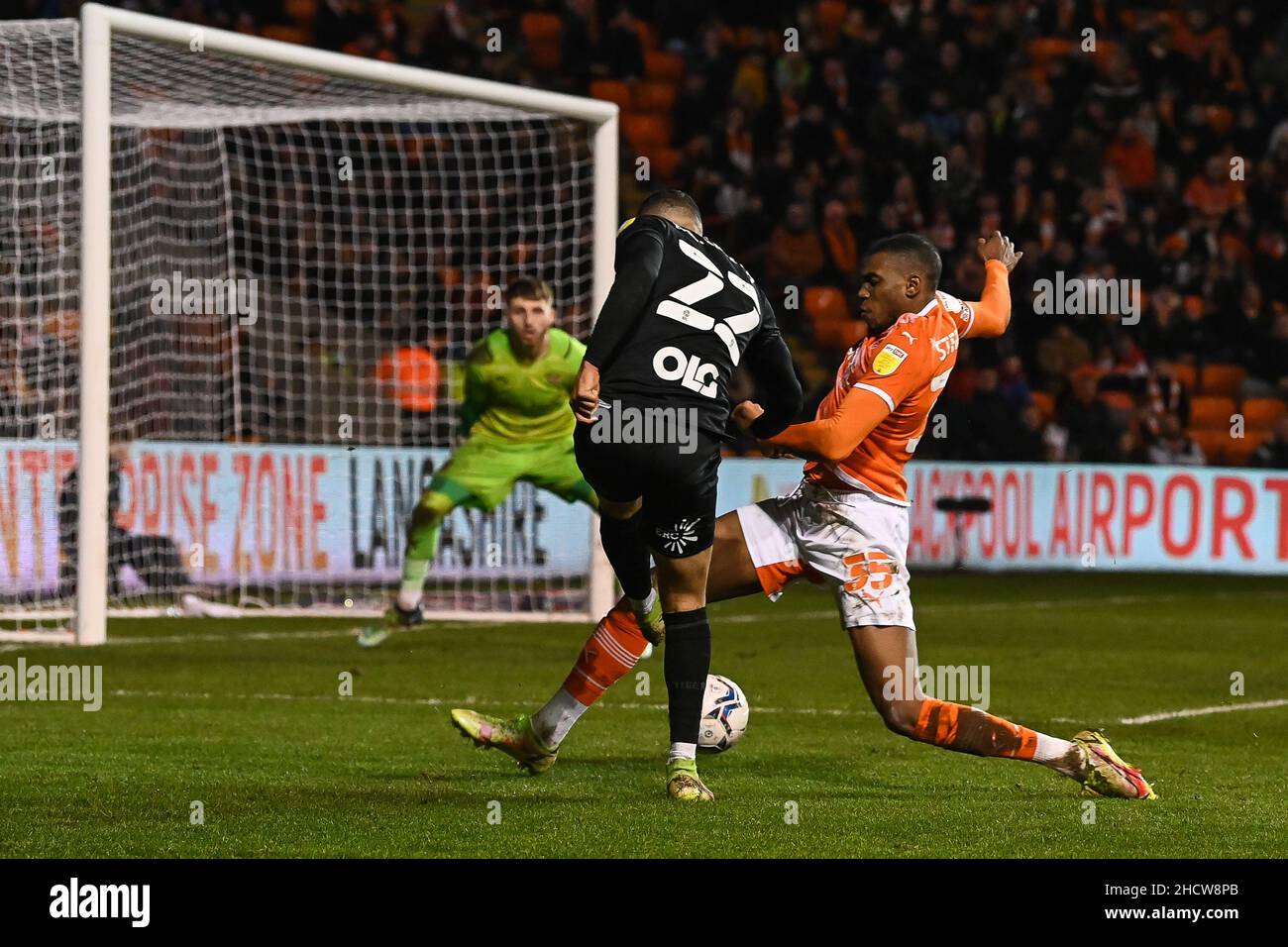 Tyler Smith #22 of Hull City crosses the ball but is blocked by Dujon ...