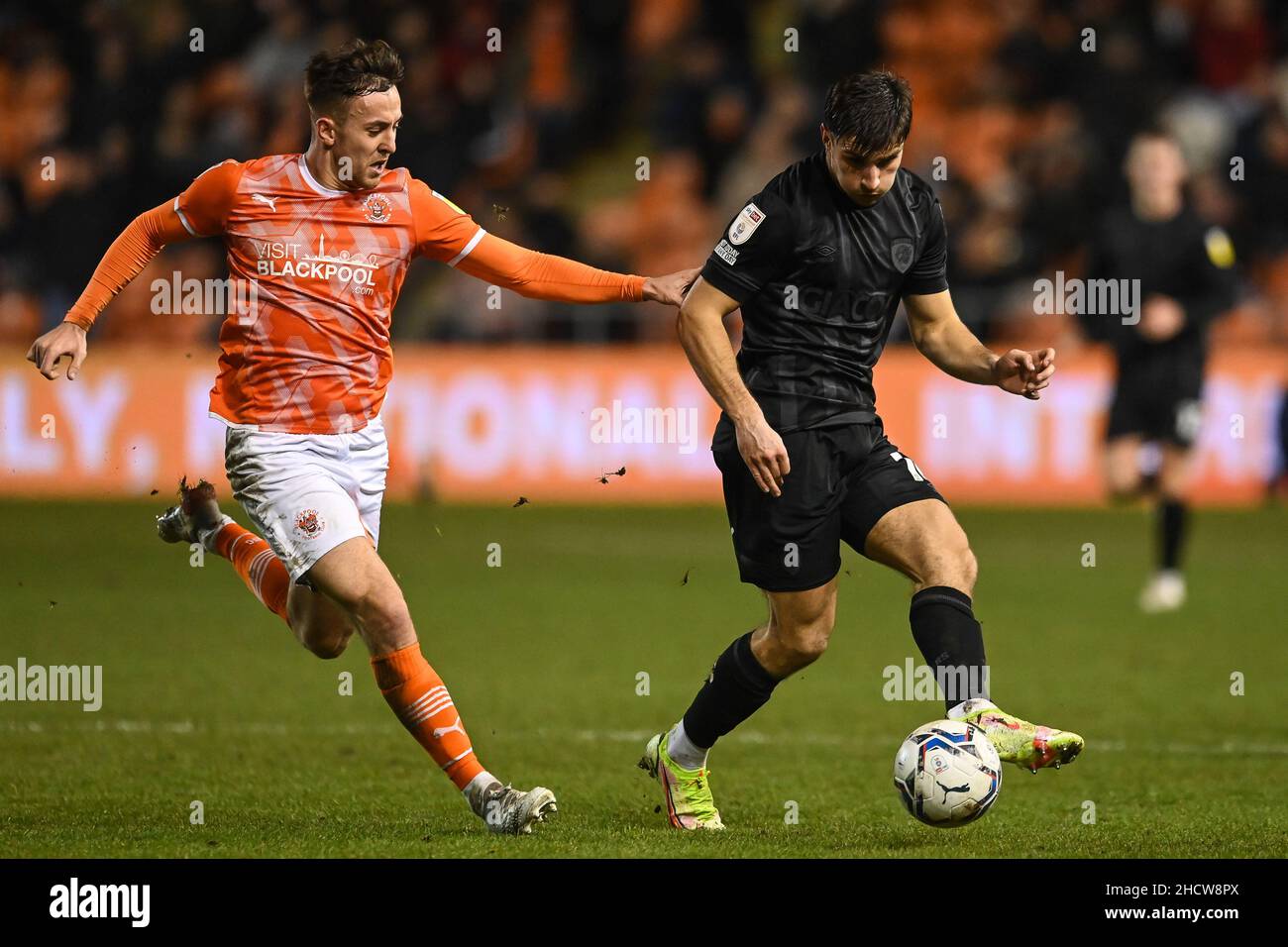 Ryan Longman #16 of Hull City makes a break with the ball despite ...