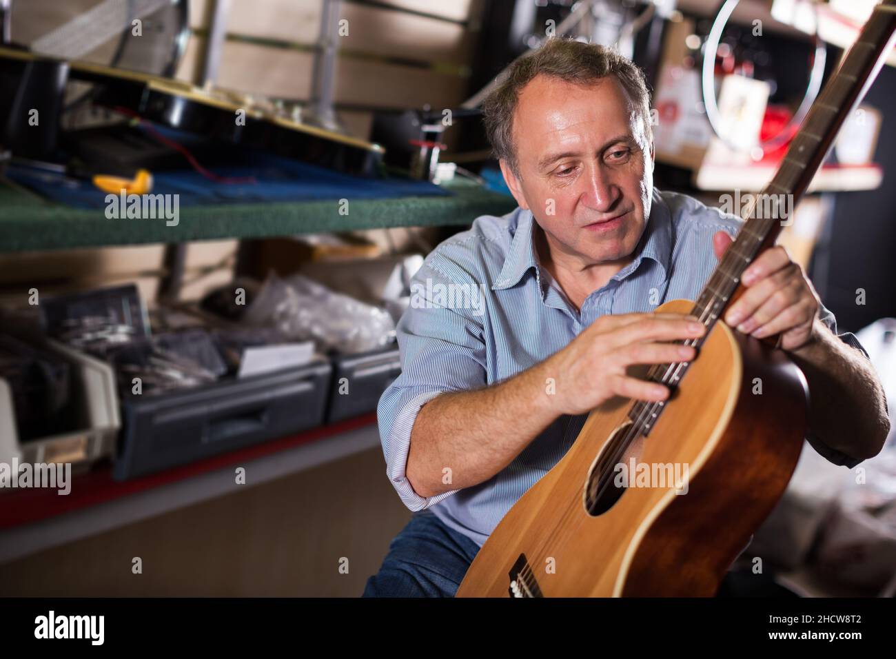 Repairing musical instruments hi-res stock photography and images - Alamy