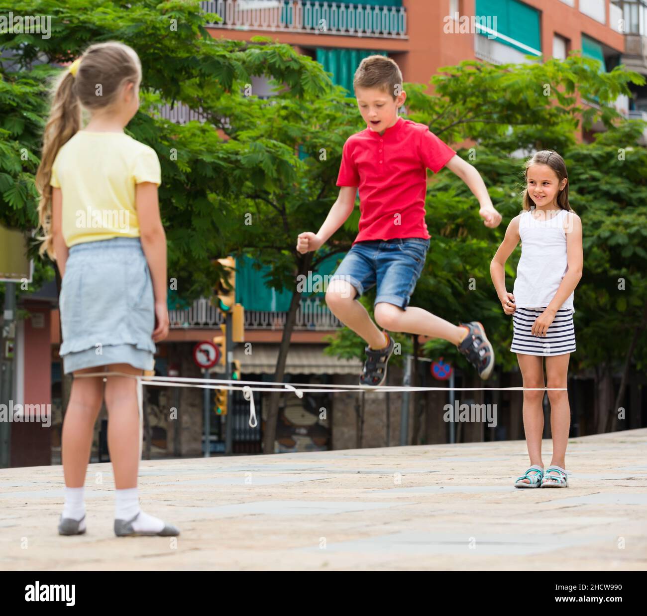 children with chinese jumping rope Stock Photo - Alamy