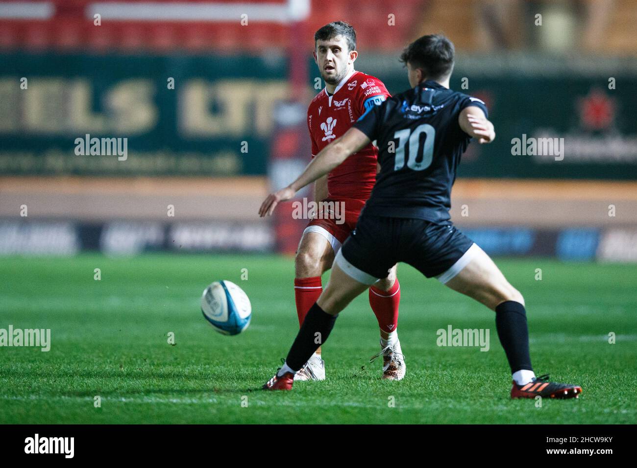 Llanelli, UK. 1 January, 2022. Scarlets fly half Dan Jones kicks the ...