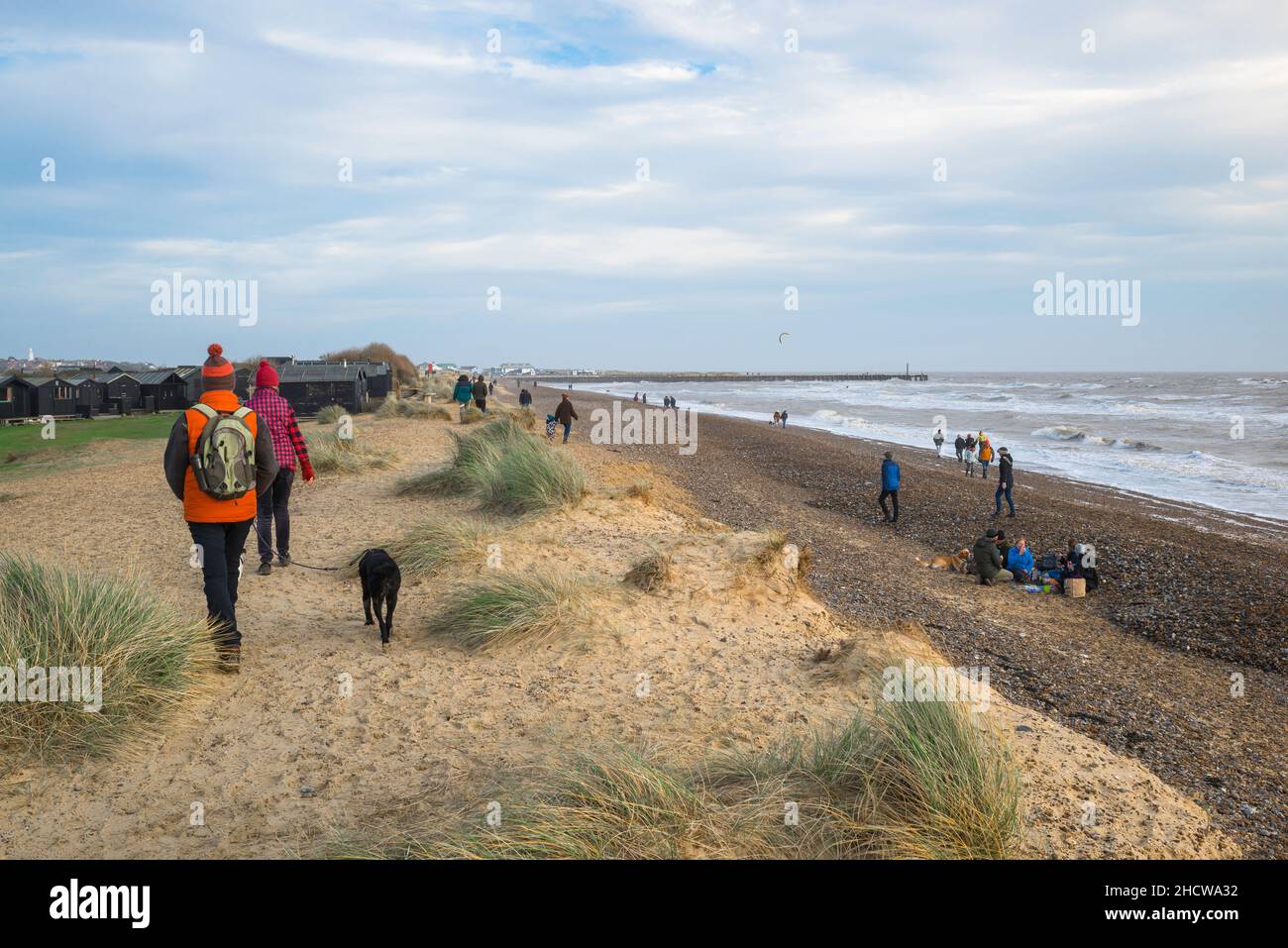 Suffolk Coast Path, out of season view of people walking north through ...