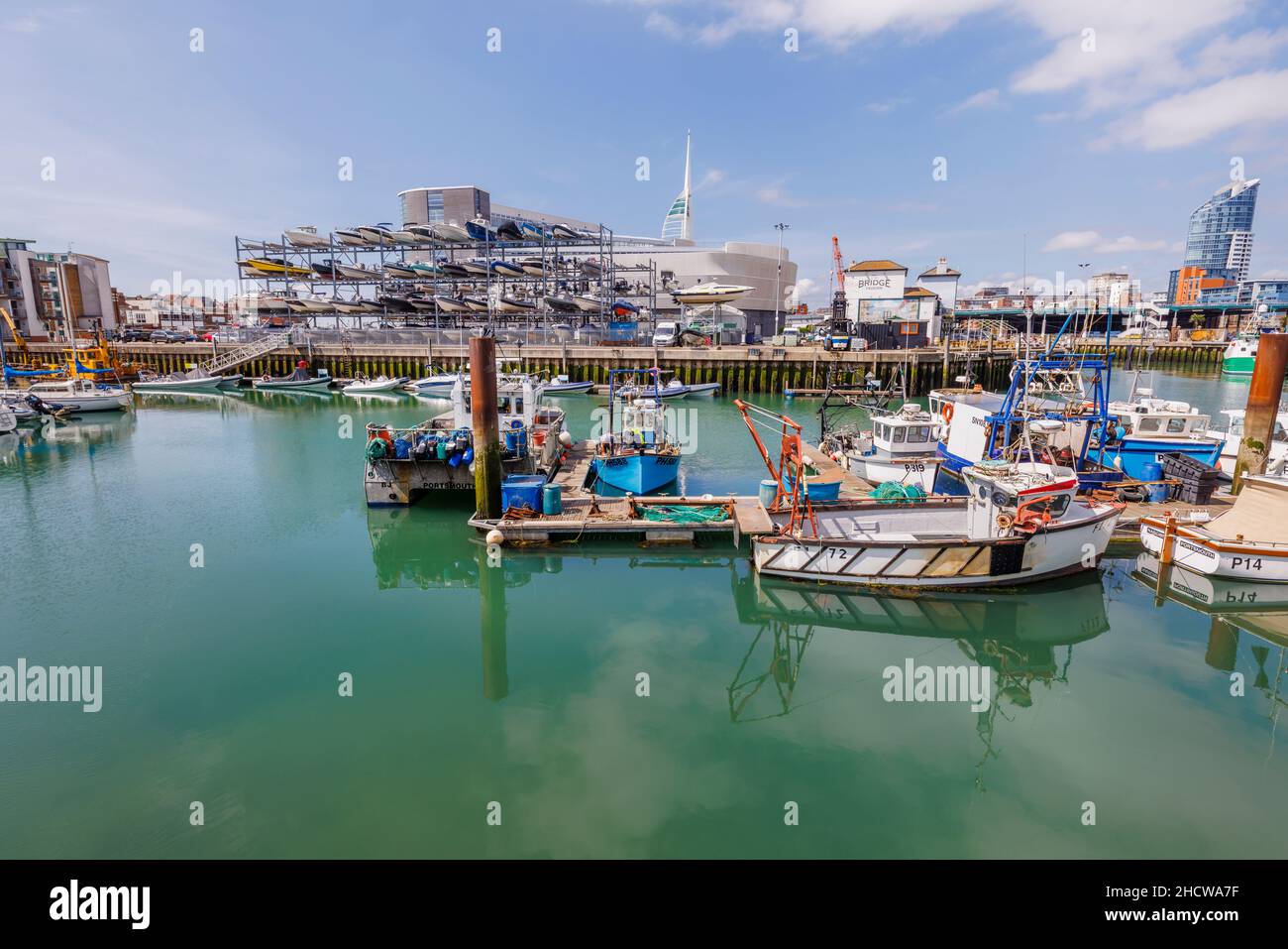 Dry stack and fishing boats moored in Camber Quay in Portsmouth Harbour ...