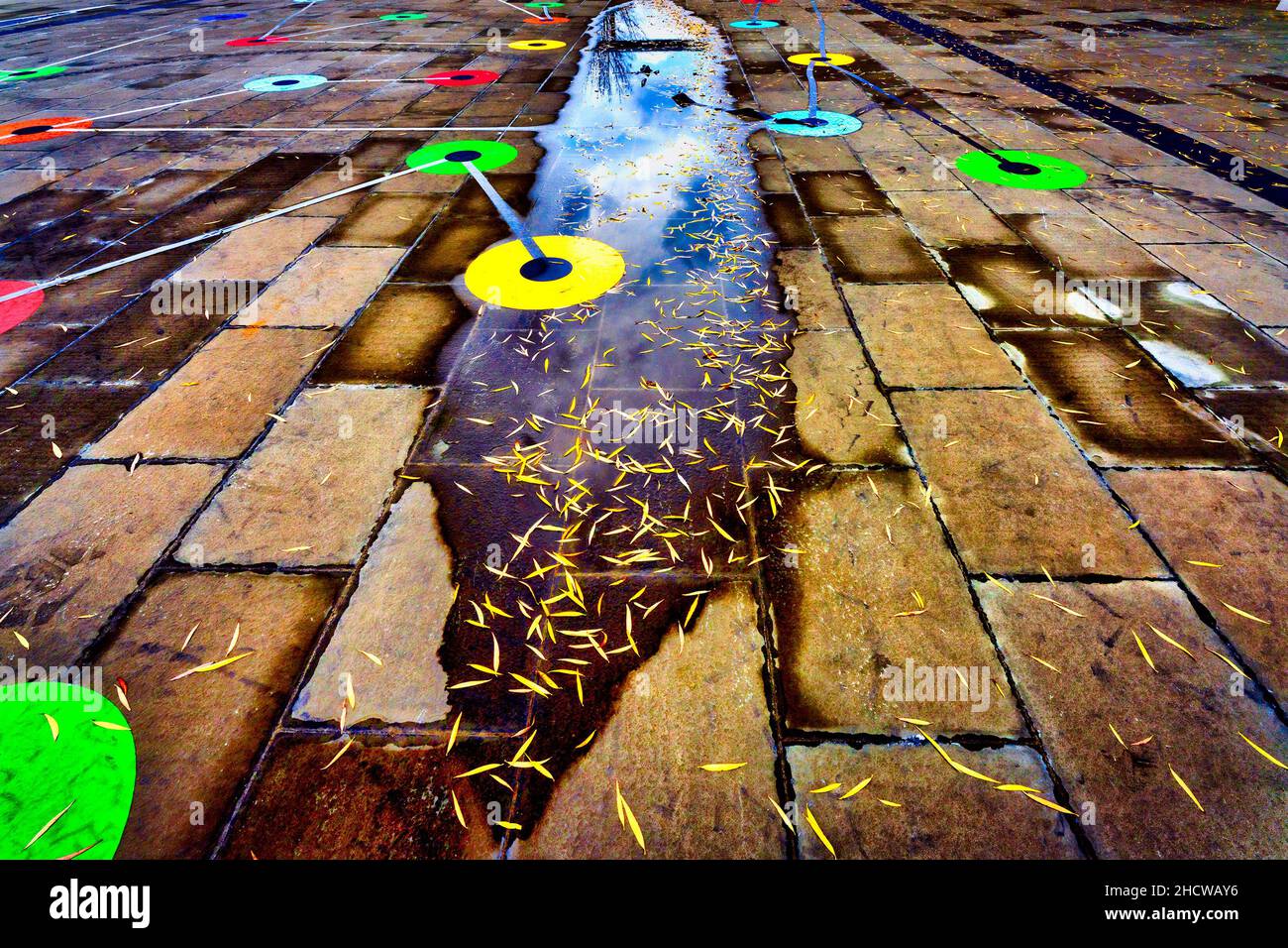 Pool of water in an Art on the street, maze on the floor of The Reach ...