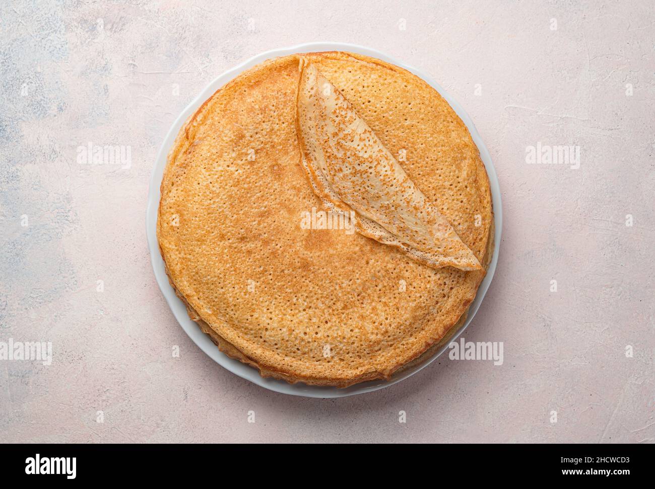 Traditional Russian blini on a light background. Fried pancakes in a ...