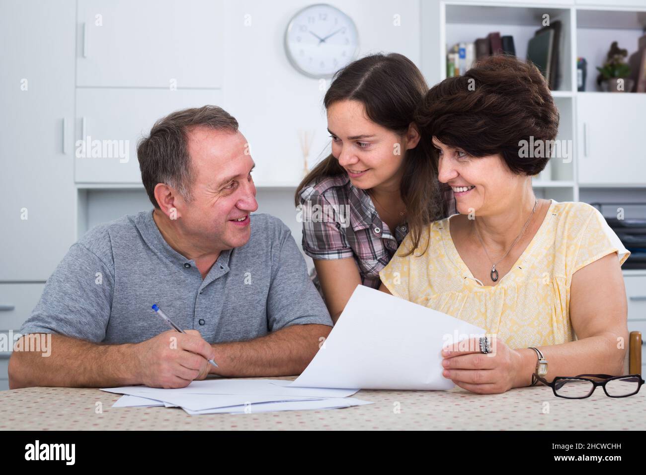 Man reading documents family hi-res stock photography and images - Alamy